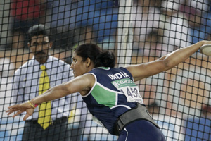 Krishna Poonia creates history,wins gold in athletics | India News ...