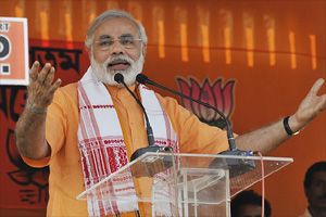 Narendra Modi taunts Cong over delay in distribution of Aakash tablets ...