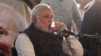 ‘Chai wala’ Modi sips tea, promises to bring black money back if he ...
