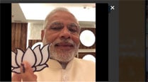 Narendra Modi snaps a selfie after casting vote | Political Pulse News ...