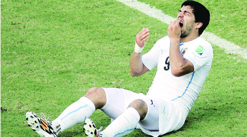 FIFA World Cup: Luis Suarez bites Chiellini, Italy bite dust | Football ...