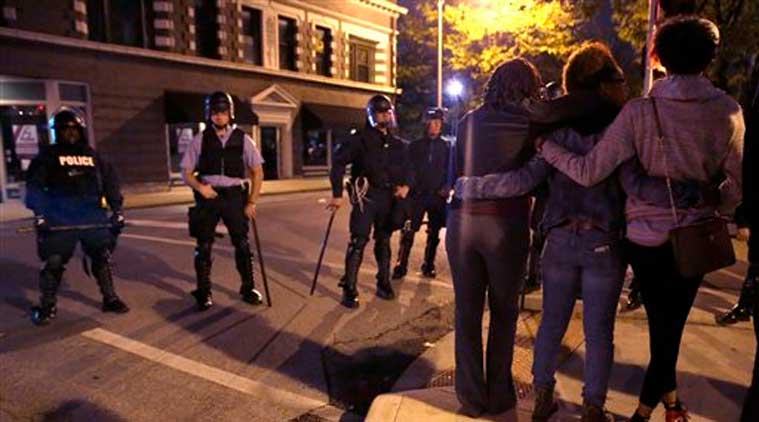 Angry protesters yell at riot police in St. Louis after fatal shooting ...