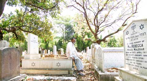 In a Mumbai cemetery, a caretaker and a tomb engraver help families ...