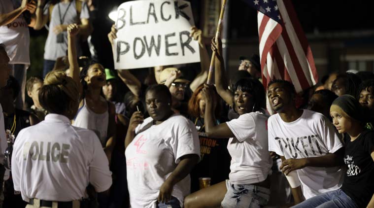 Protesters take to Ferguson streets to mark anniversary of Michael ...
