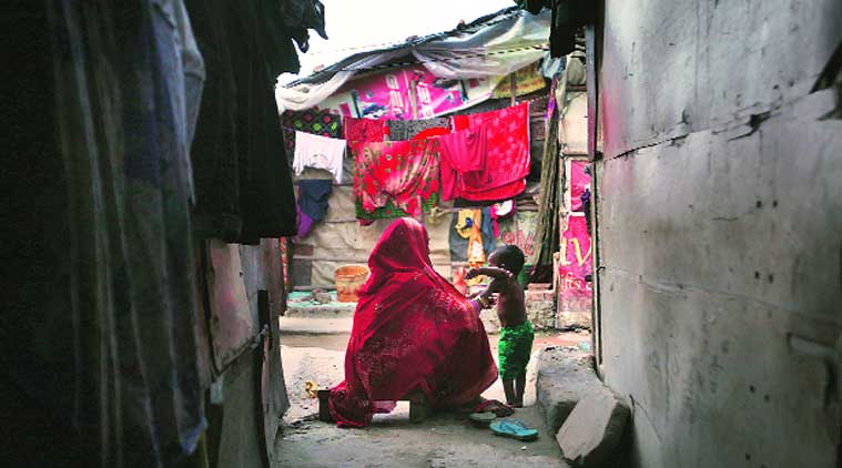 In a slum, dreams of a home across a barbed-wire fence | Delhi News ...