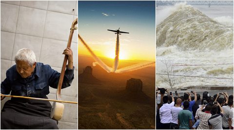 Top Frames: Candlelight vigil, China National Day, aerial feats ...