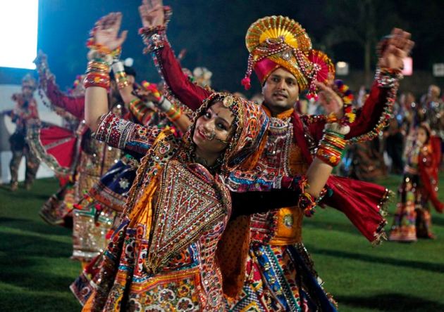 People take part in Dandiya Raas during Garba nights | Picture Gallery Others News - The Indian ...