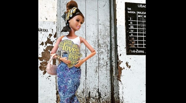 Barbie poses as clueless aid worker in Africa in this satirical photo ...