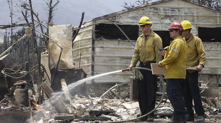 California wildfire: Firefighters start to get deadly blaze under ...