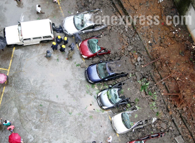 Thane: Heavy rain causes wall to collapse over 10 cars | Picture ...