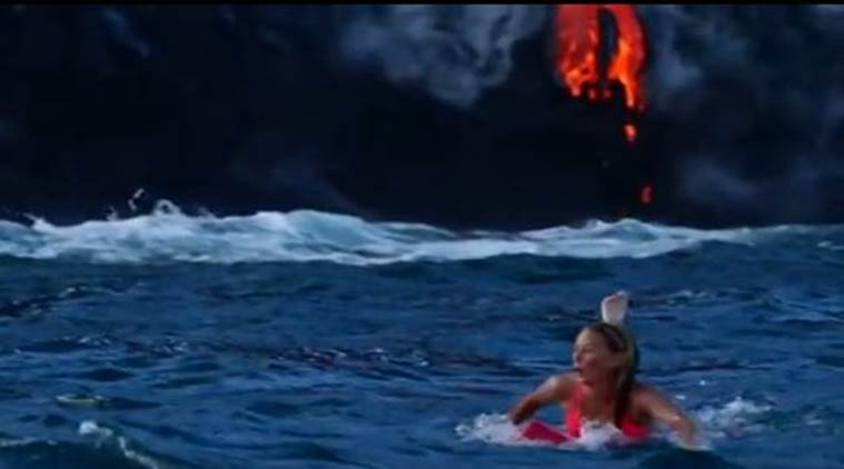 Video: This woman swims around erupting volcano and is not scared at ...
