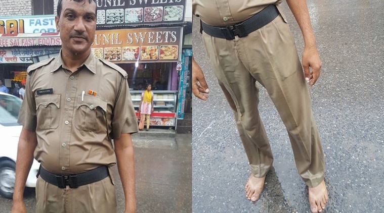 Photo of Haryana policeman doing duty barefoot in heavy rains goes ...