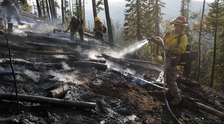 US Wildfire blocking Yellowstone National Park entrance smolders on ...