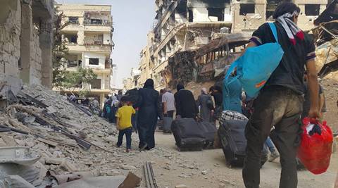 Syria: Strike kills 25 in as rebels surrender Damascus suburb | World ...