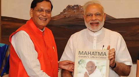 Modi presented with first copy of new book on Mahatma | Art-and-culture ...