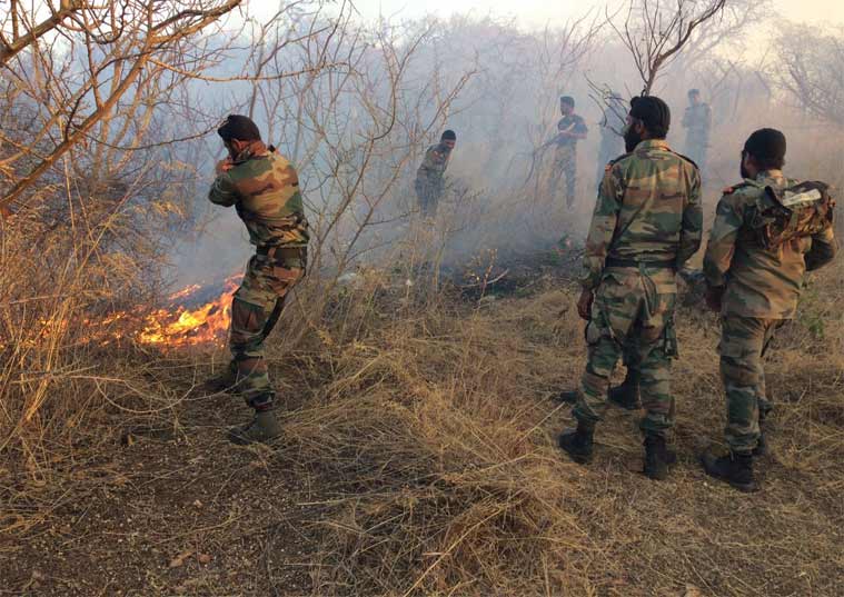 EXCLUSIVE: Daring images of massive forest fire fighting operation in ...