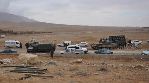 Syrian troops after taking Palmyra from IS, clear explosives | World ...