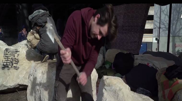 Watch: Workers break stones placed on Paris street to let migrants ...