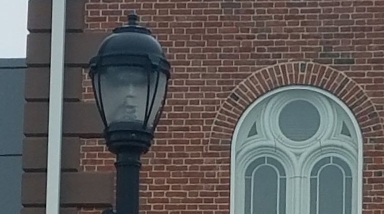 This eerie picture of a ghostly face in a street lamp is creeping ...