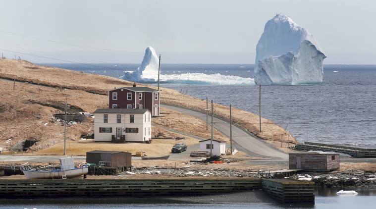 Fascinating sight of massive iceberg floating on Canada’s coastal shore ...