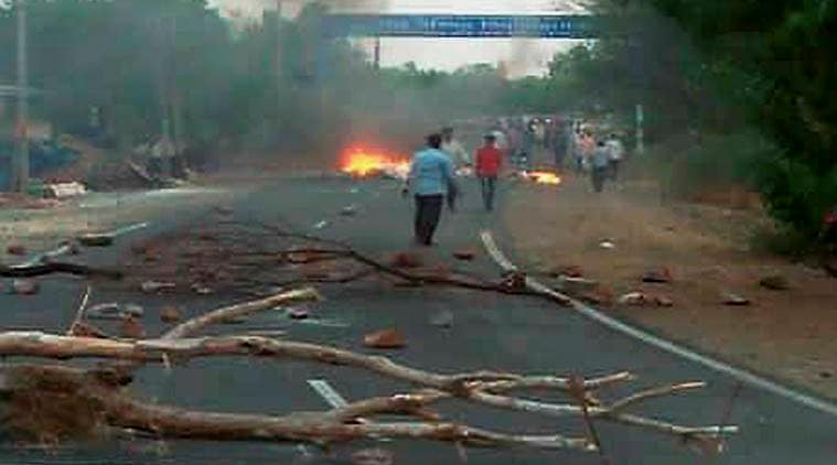 Madhya Pradesh protesters defy curfew, torch vehicles, target police ...