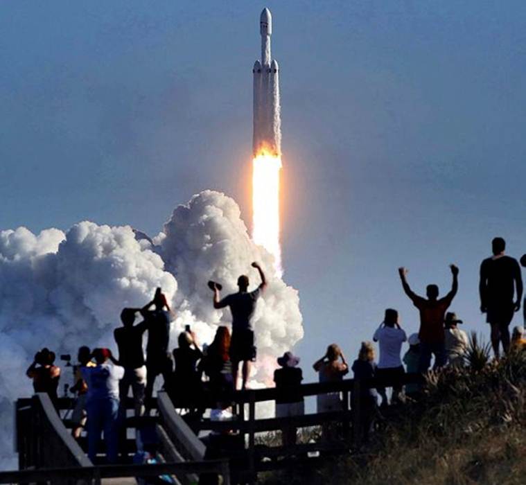 Spacex Falcon Heavy rocket successfully soars into space with Tesla ...