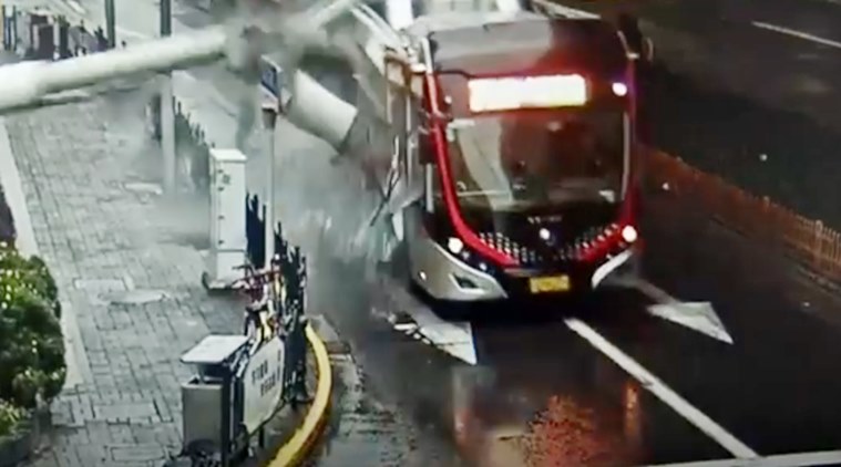 VIDEO: Due to heavy wind pillar breaks and falls on moving bus; damages ...