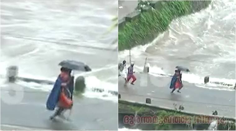 VIDEO: Kerala rains rescue worker runs across bridge with child in arms ...