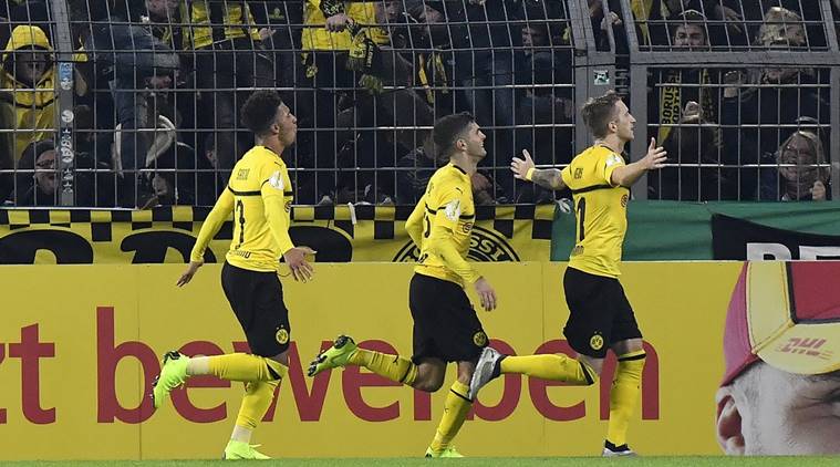 Last-gasp Marco Reus penalty sends Borrusia Dortmund into German Cup ...