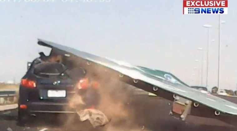 Video: Moment when overhead road sign falls on car in Australia, driver ...