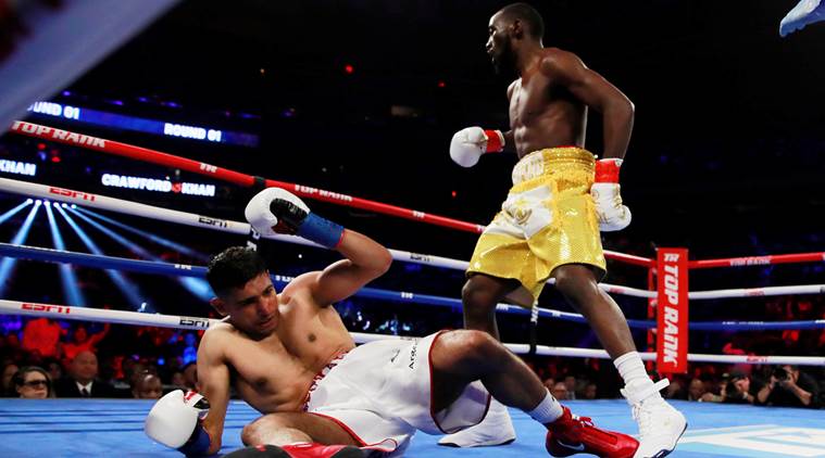 Terence Crawford wins by technical knockout when Amir Khan doesn’t go ...