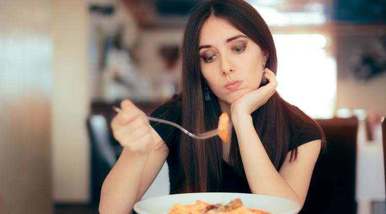 Want to cut down on your daily food intake? Eating solo could help ...