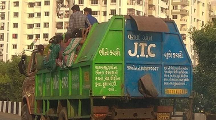 Surat photo goes viral: Contractor ferries labourers in garbage vehicle ...