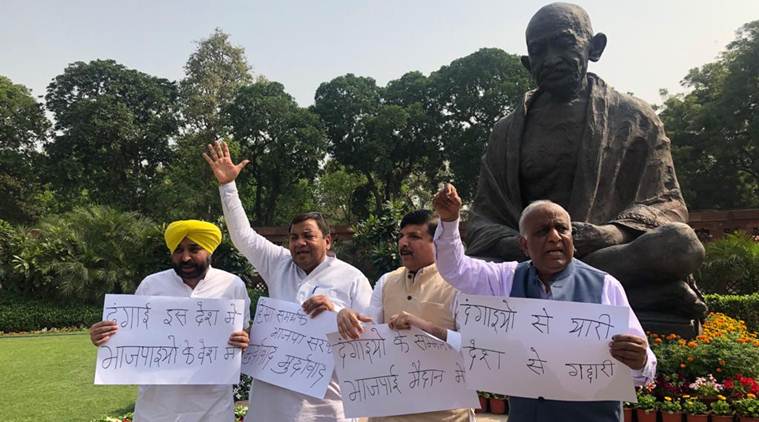 Opposition stages protest in front of Gandhi statue in Parliament over ...