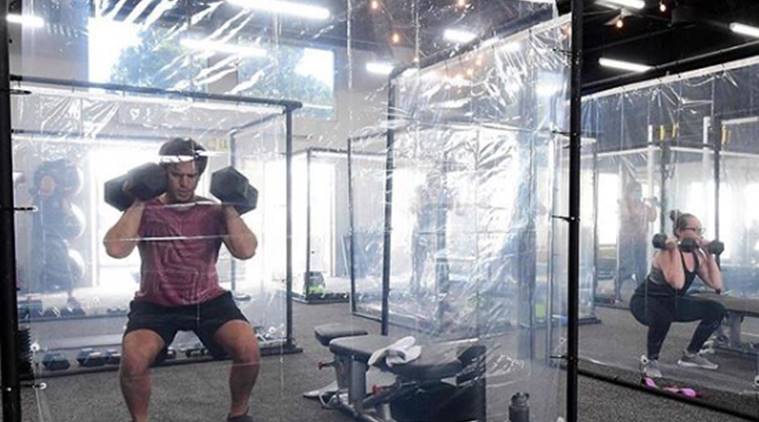 COVID-19: This gym set up plastic pods to create safer workout spaces ...