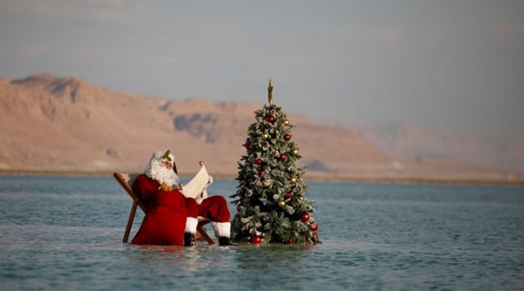 Man dresses as Santa Claus and takes dip in Dead Sea to spread ...