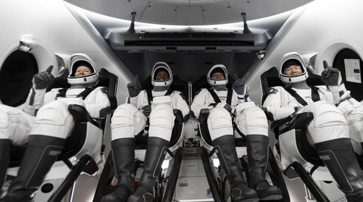 SpaceX’s Dragon docks at Space Station with four astronauts ...