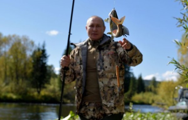 Caught on camera: Kremlin releases photos of Putin’s Siberian fishing ...