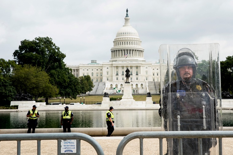 Riot shields and metal detectors are a reminder of deadly US Capitol ...
