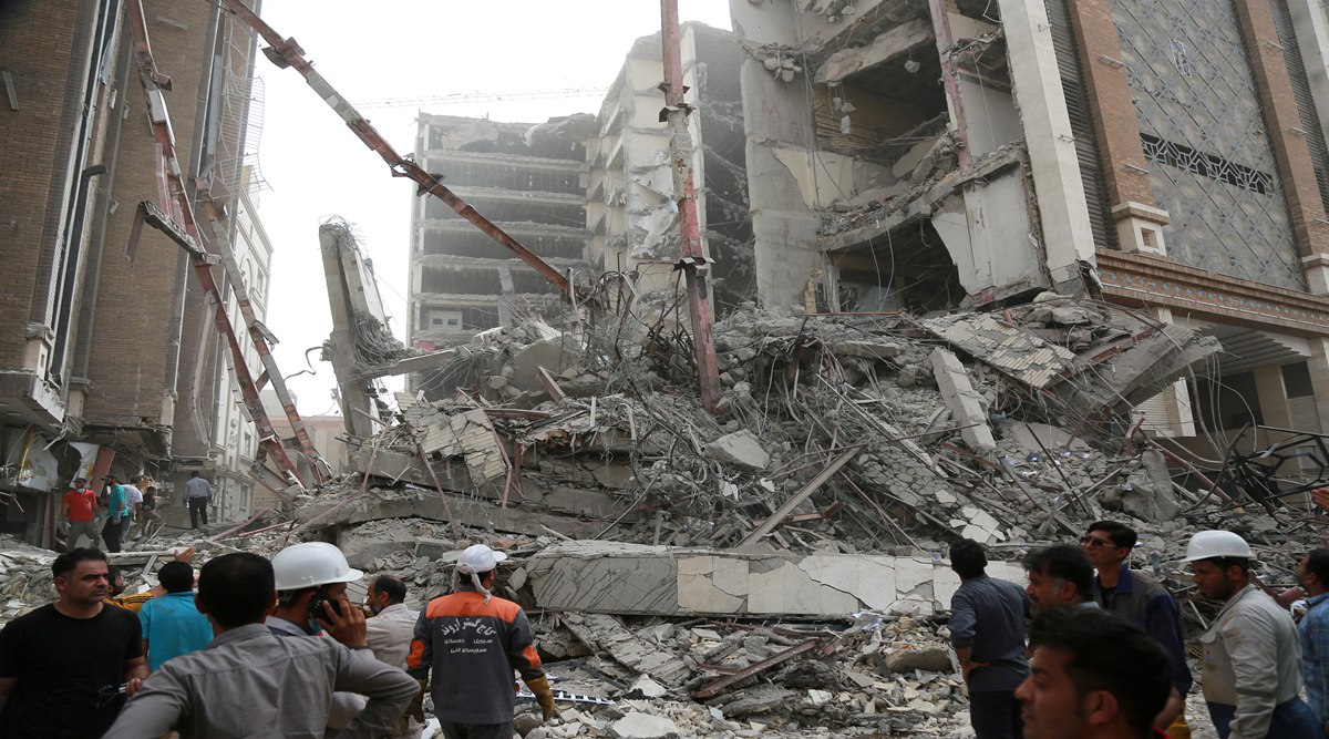 Crowd confronts cleric at Iran tower collapse that killed 33 | World ...