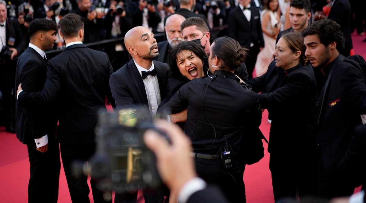 Protester painted in Ukraine colors ejected from Cannes red carpet ...