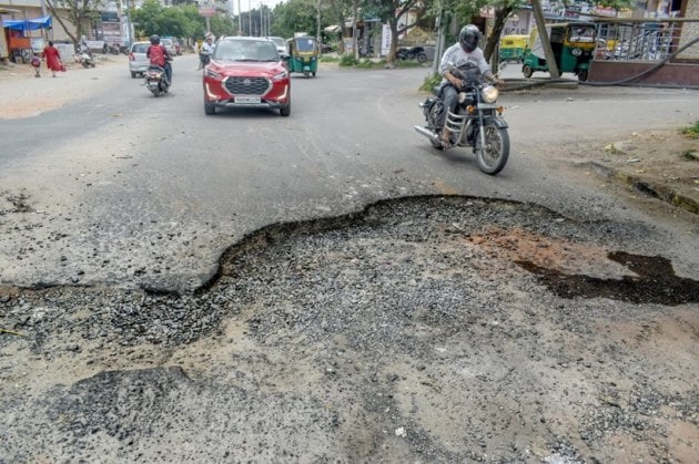In photos: Bengaluru’s pothole ridden roads remain a hazard | India ...