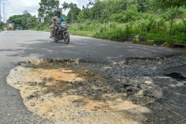In photos: Bengaluru’s pothole ridden roads remain a hazard | India ...