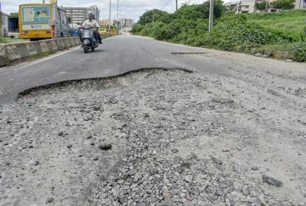 In photos: Bengaluru’s pothole ridden roads remain a hazard | India ...