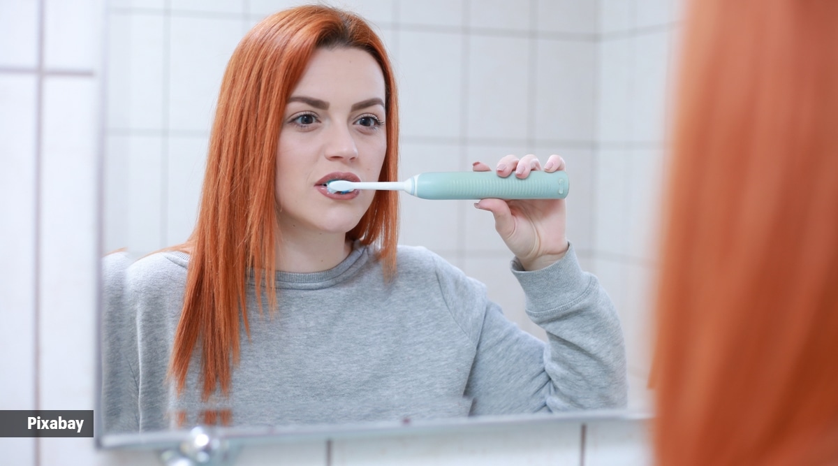 What is the proper technique to brush teeth?