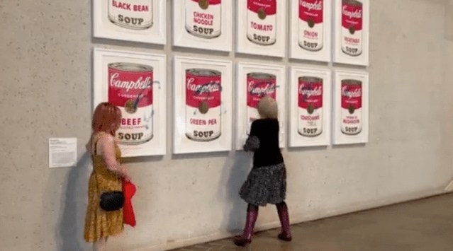 Climate activists glue themselves to Warhol artwork in Australian ...