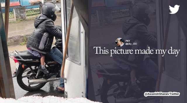 Pic of child being shielded from the rain by dad on bike is both innovative and heartwarming ...