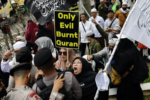 Muslim nations protest after far-right activists burn Quran in Sweden ...