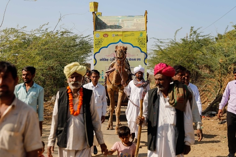 Camel carts, puppets, vaccine songs: Taking the Covid shot to the ...