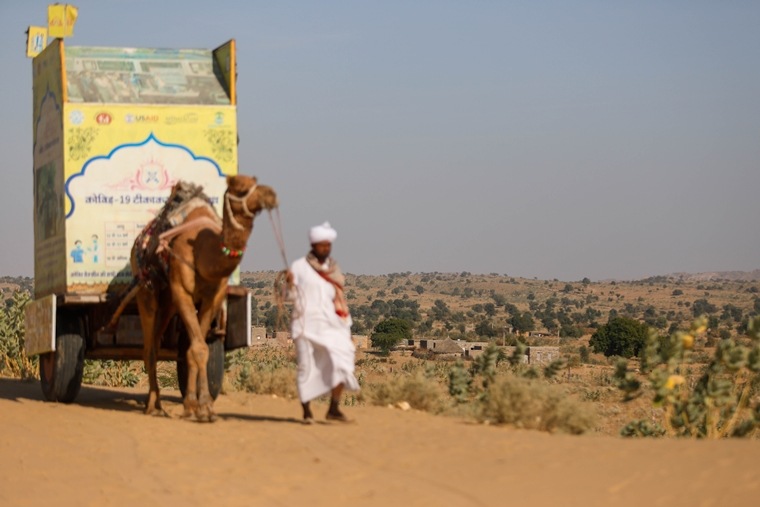 Camel carts, puppets, vaccine songs: Taking the Covid shot to the ...